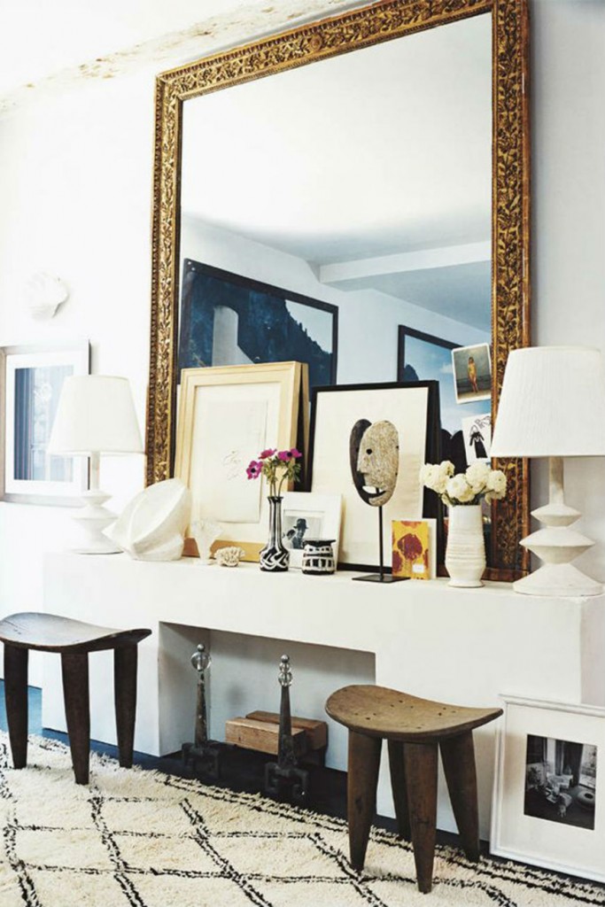 Light interior house design with vertical wall mirror.