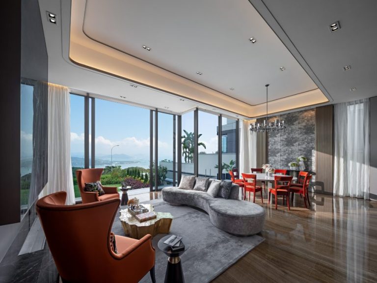 A living room with large ceiling-to-floor windows is the ideal ...